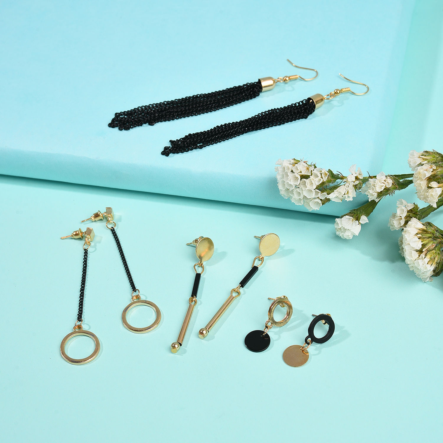 SOHI Gold-Toned Contemporary Drop Earrings